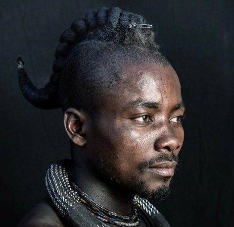 NAMIBIA: Himba man with traditional single braid - Intercultural ...